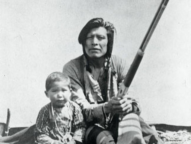 Salish Native Paul Charlo Posing With Rifle and Little Boy
