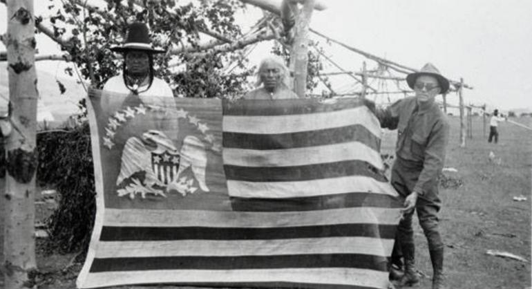 Two Native American Men Pose with 1803 Peace Flag Over 100 Years Later
